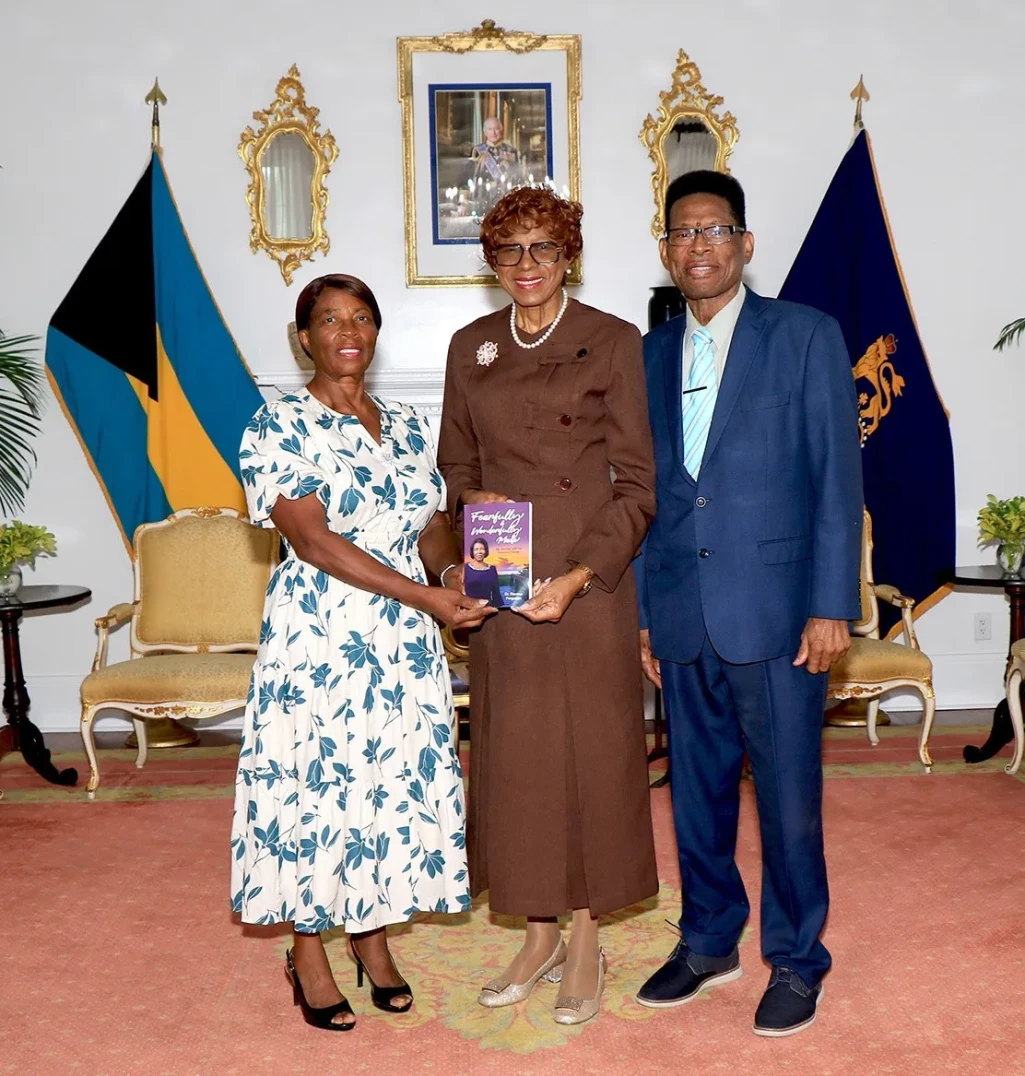 Mrs. Rovena Ferguson presents her book to the Governor Gener
