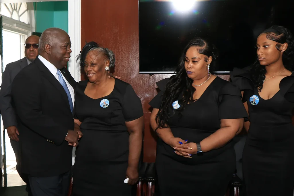 Prime Minister Philip Davis pays respects to the late Rodney
