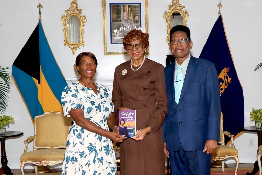 Mrs. Rovena Ferguson presents her book to the Governor Gener