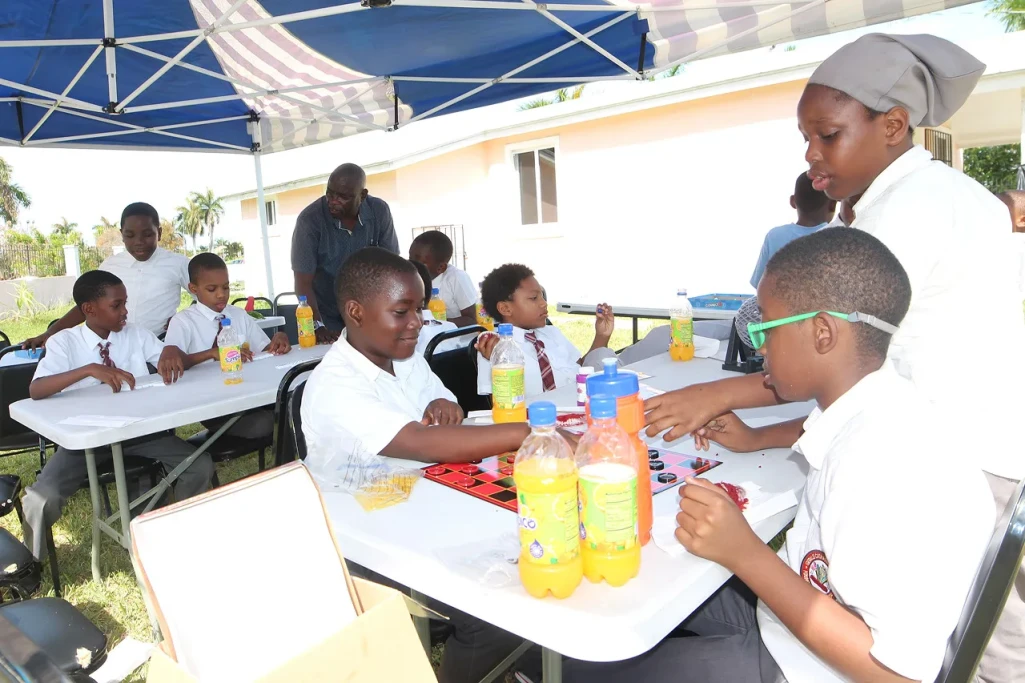 Boys enjoy playing board games, celebrating International Da