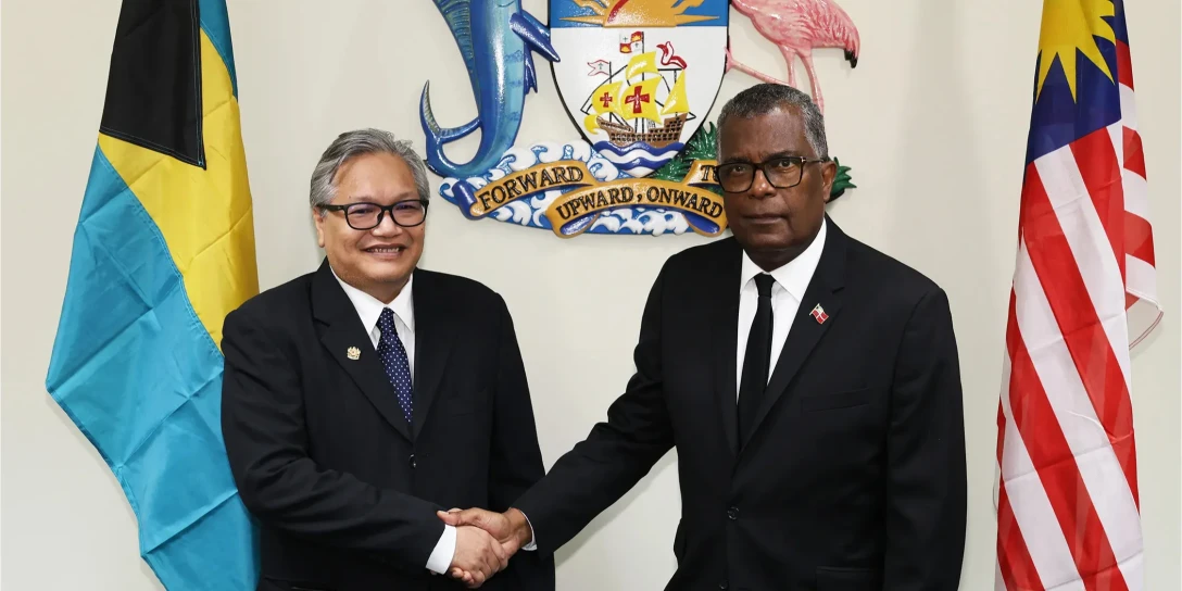 Foreign Affairs Minister Mitchell greets Malaysia's High Com